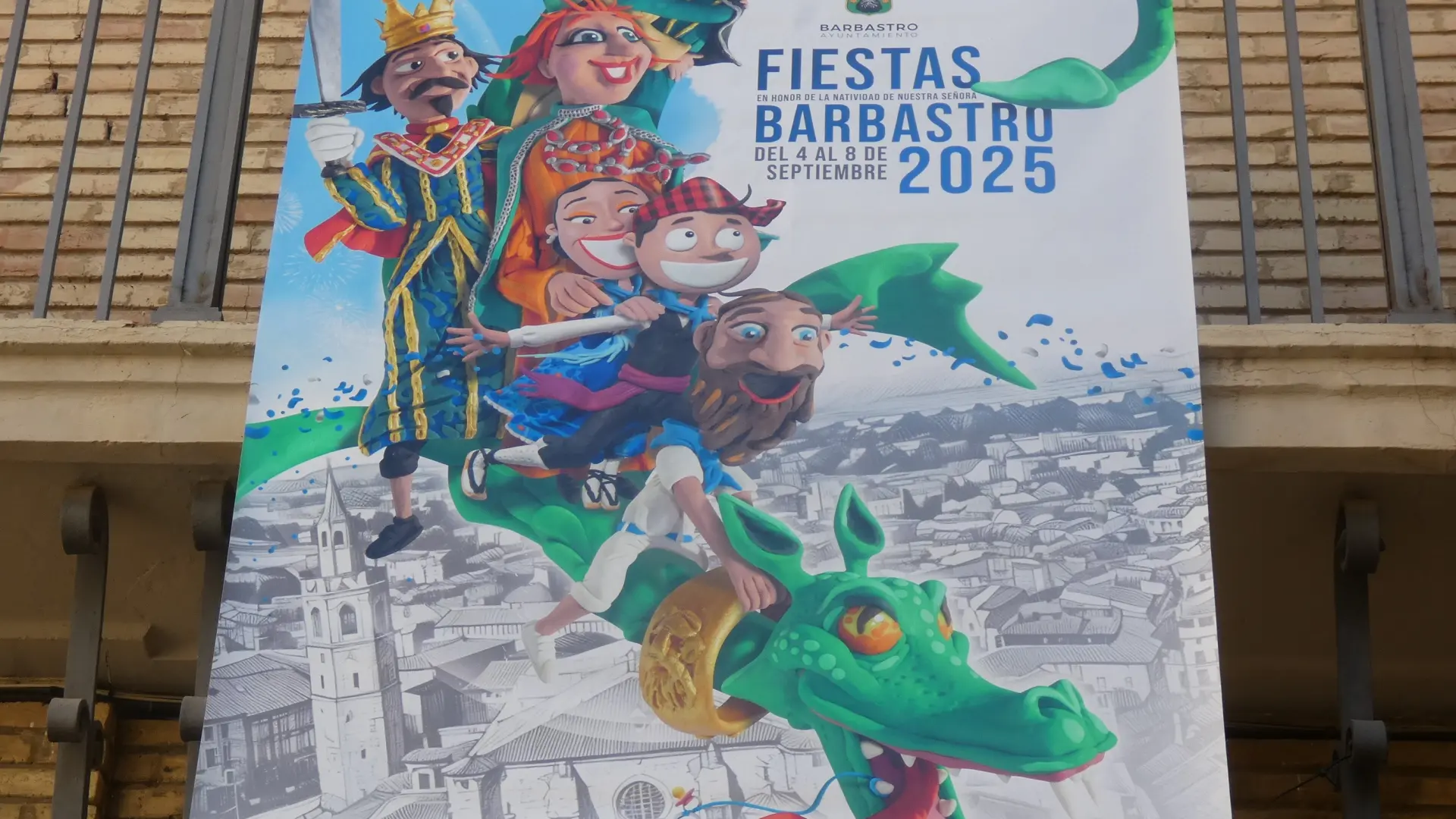El dragón Belaín sobrevuela Barbastro en el cartel de Fiestas 2025